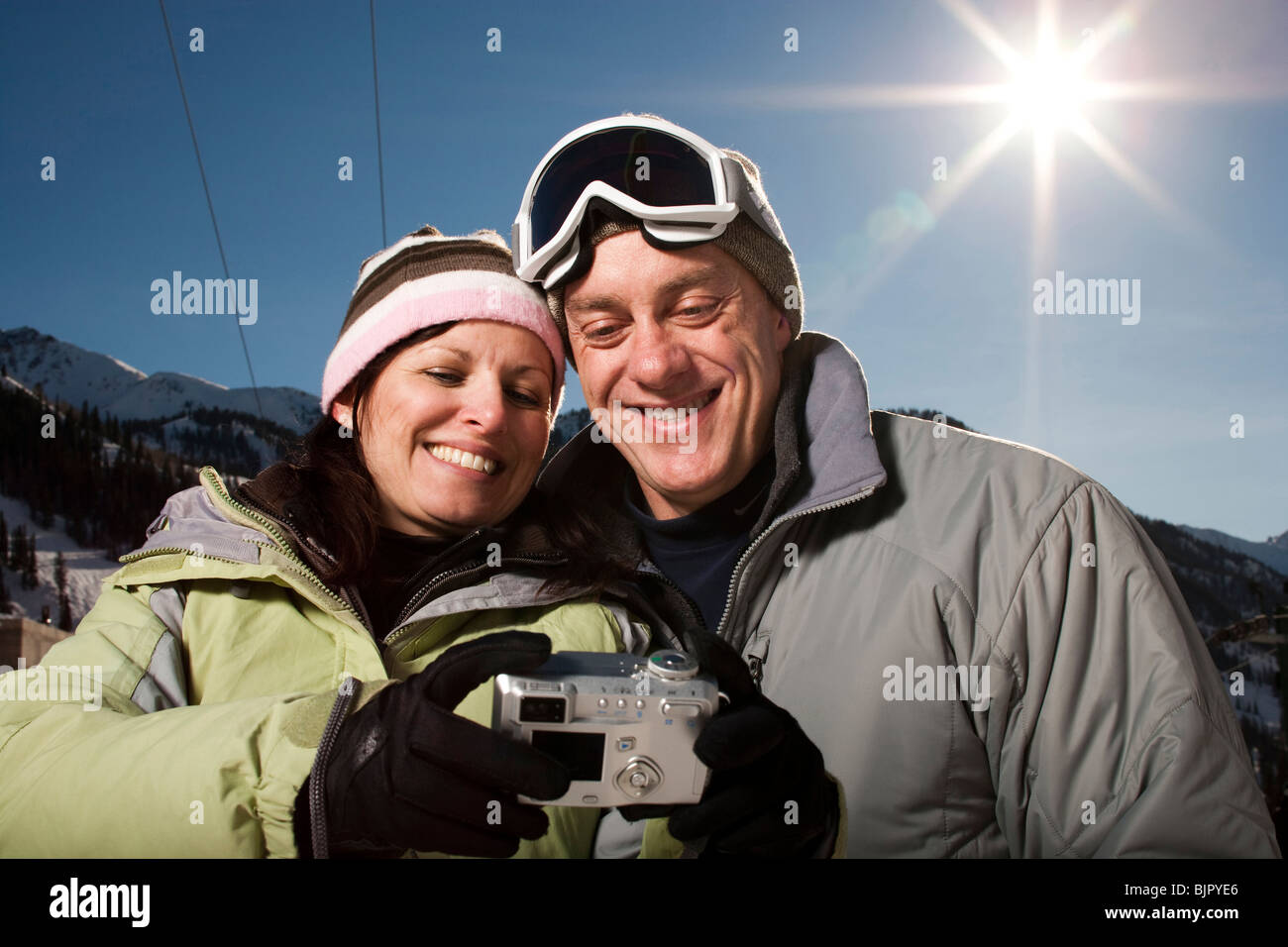 Couple using a camera outside Stock Photo - Alamy