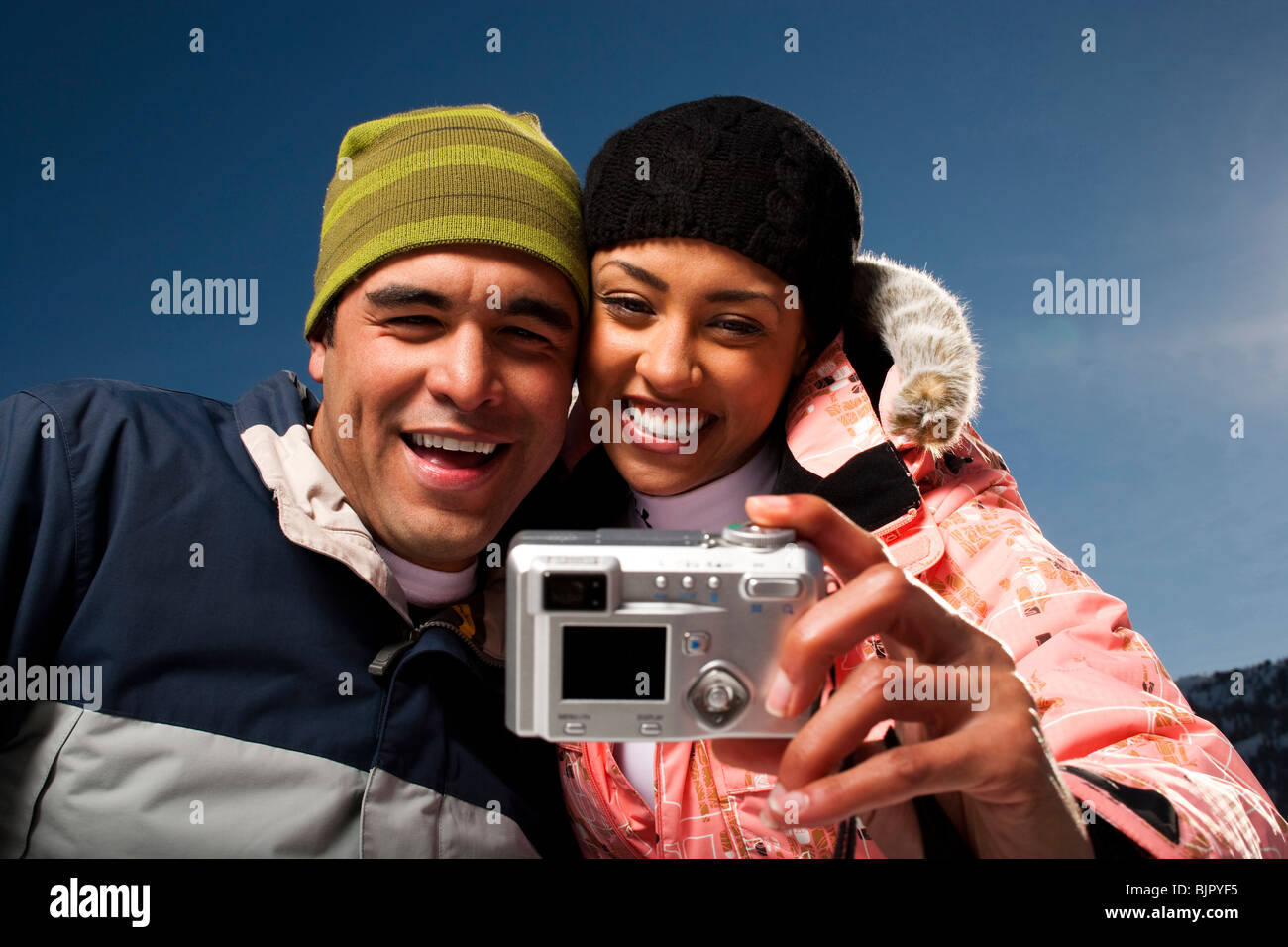 Couple using a camera outside Stock Photo - Alamy