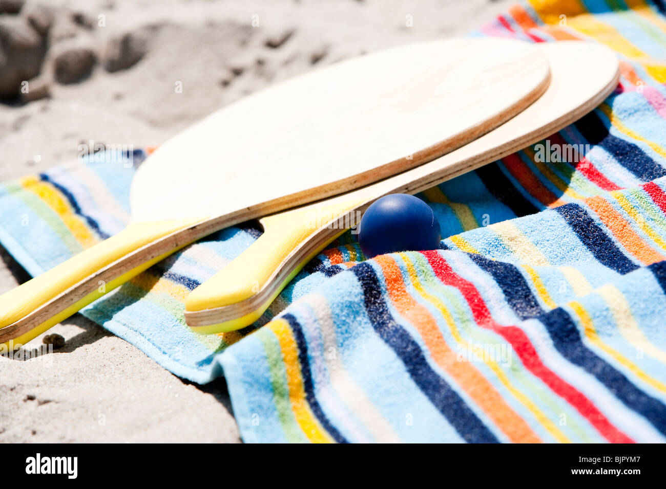 Paddles on a towel at the beach Stock Photo - Alamy