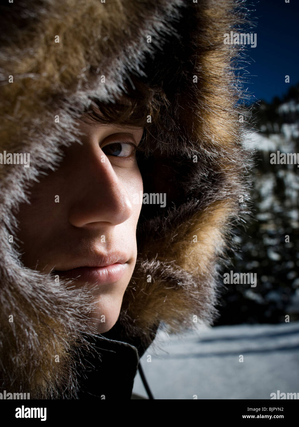 Teenage boy outside in the snow Stock Photo - Alamy