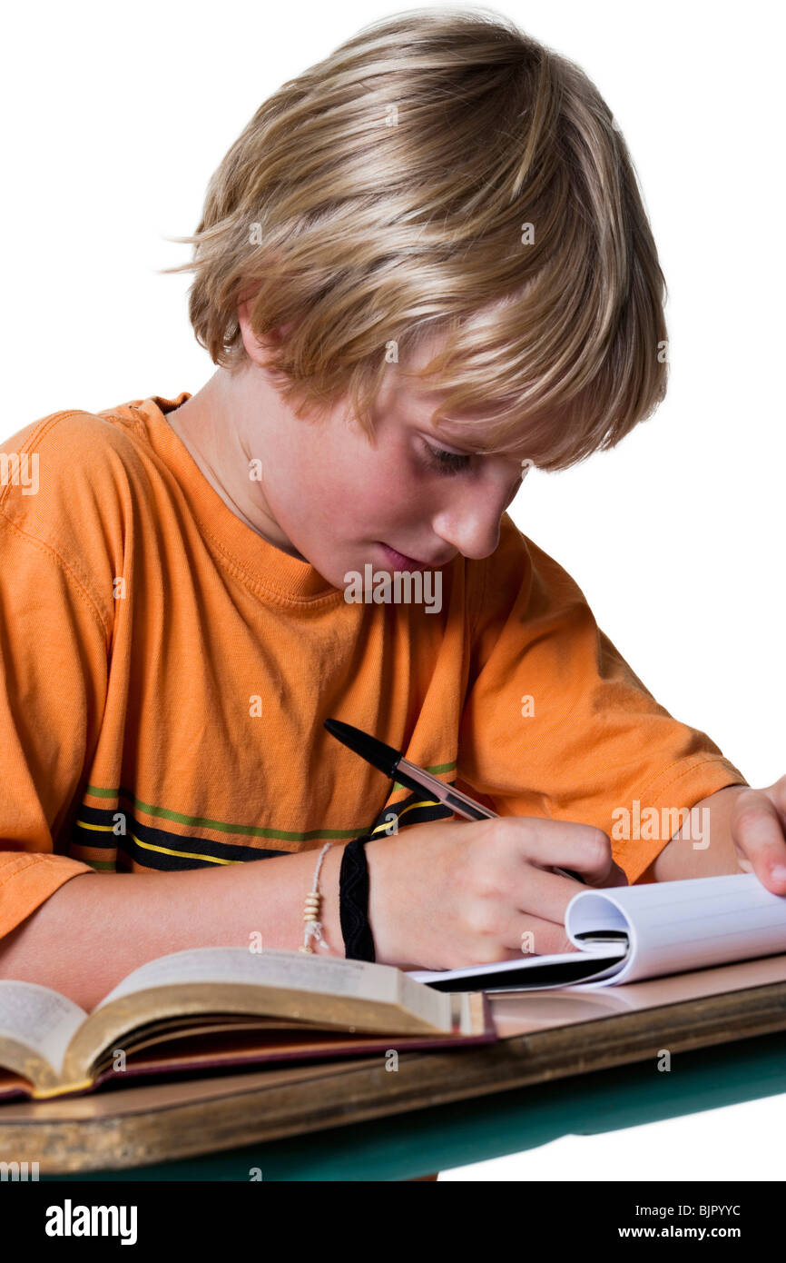 Boy doing school work Stock Photo - Alamy