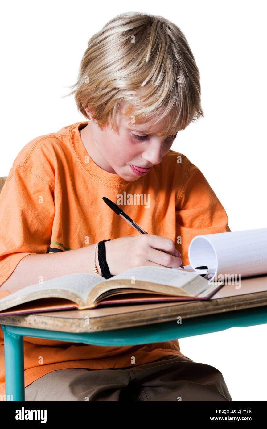 Boy doing school work Stock Photo - Alamy