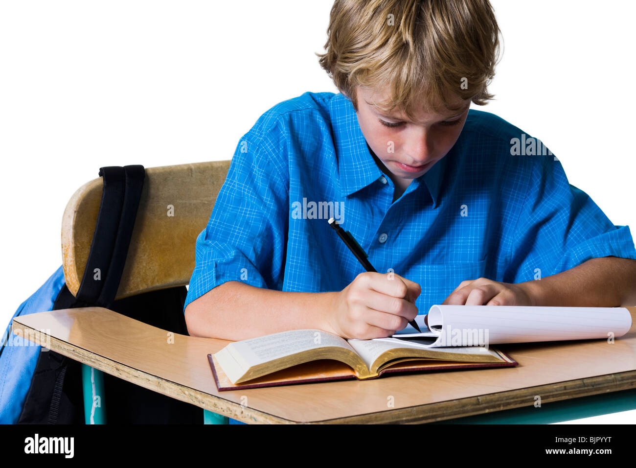 Boy doing school work Stock Photo - Alamy