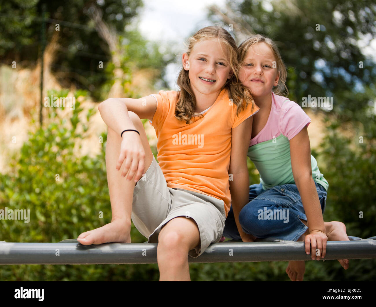 Two girls outside with braces Stock Photo - Alamy