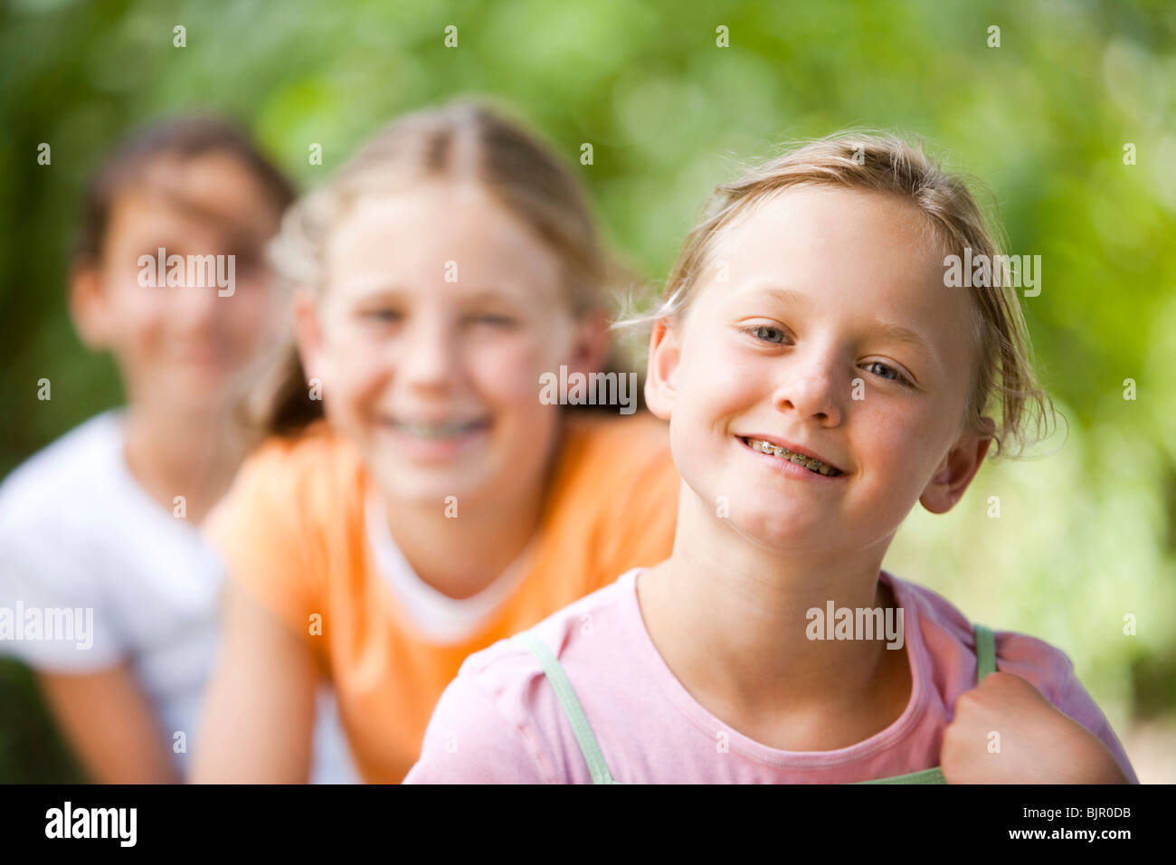 Three girl friends outside Stock Photo - Alamy