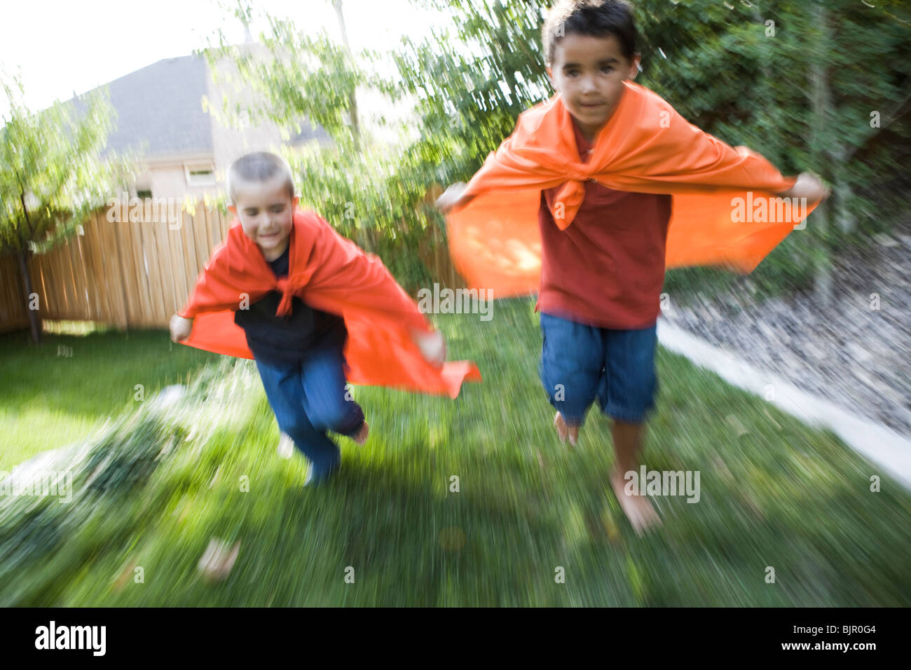 Boys playing outside Stock Photo - Alamy
