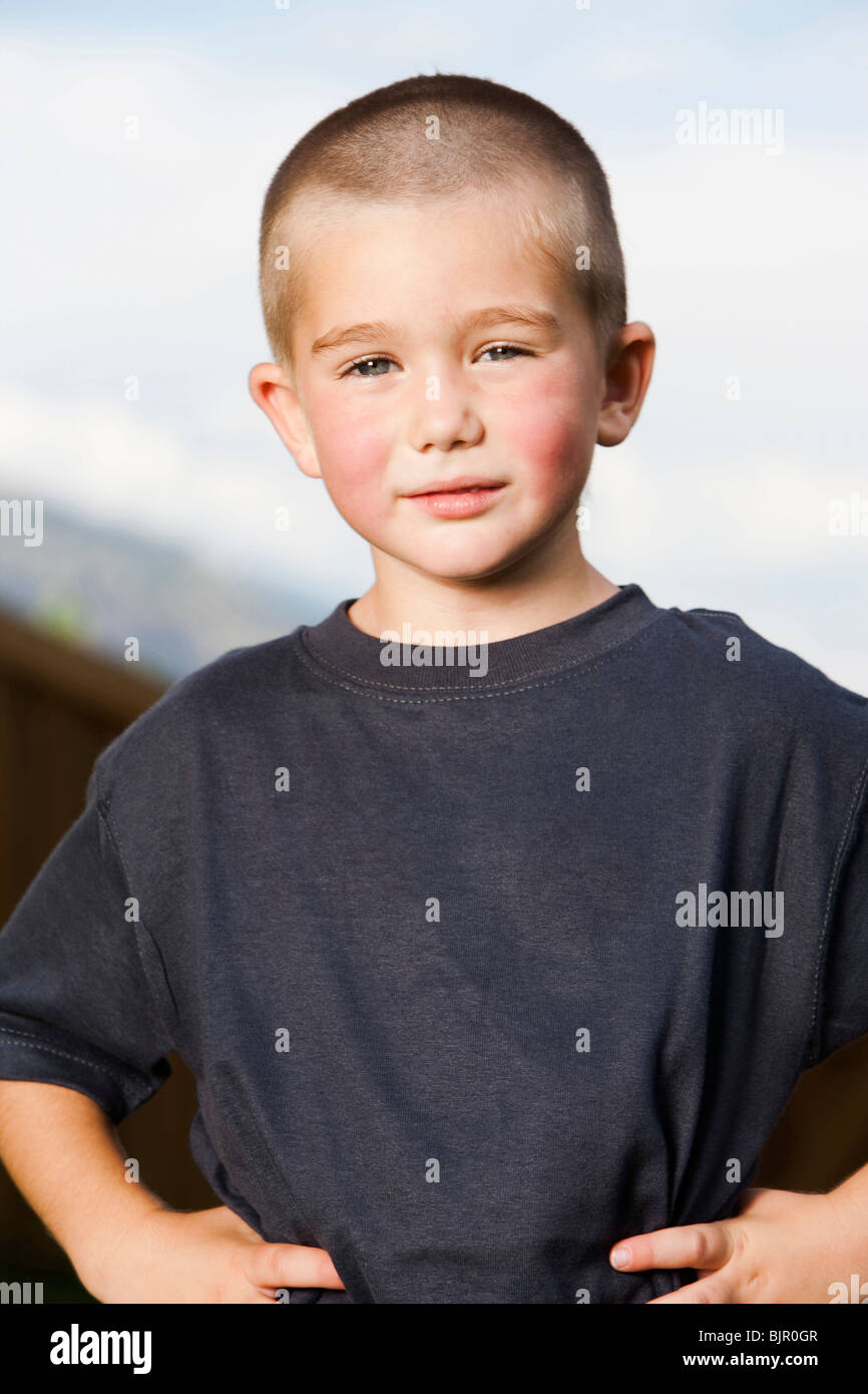 Boy standing outside Stock Photo - Alamy