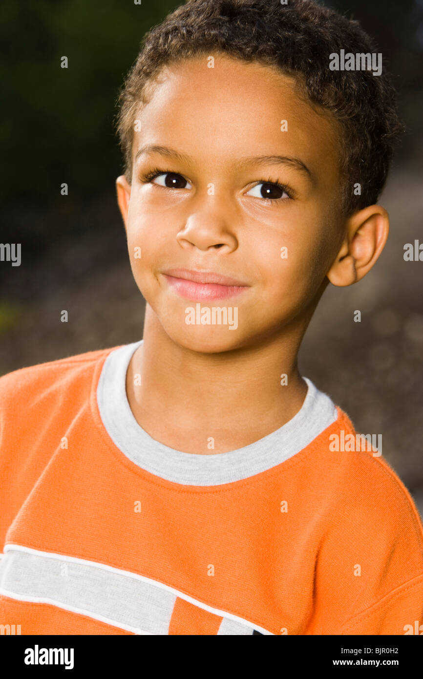 Boy smiling outside Stock Photo - Alamy