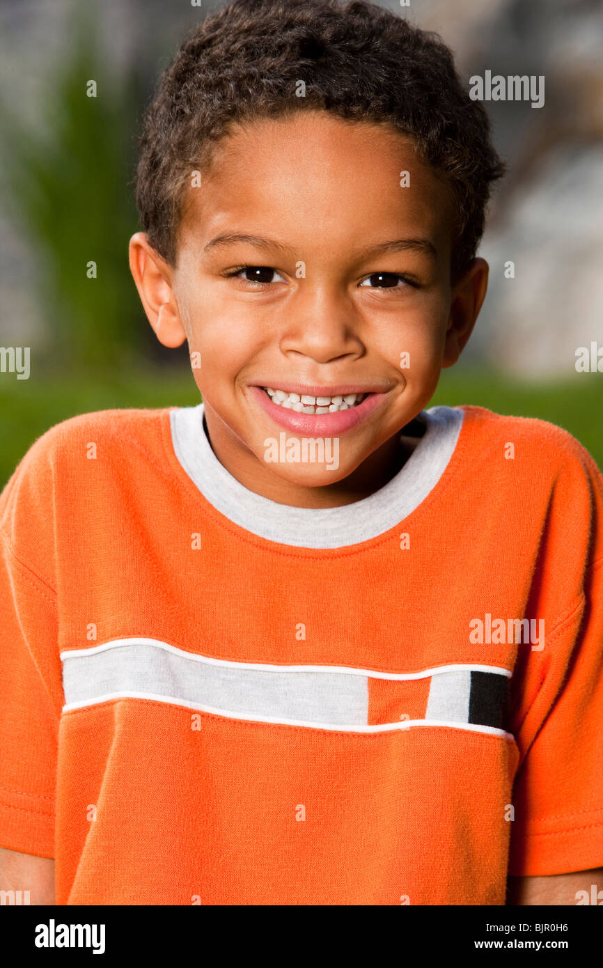 Boy smiling outside Stock Photo - Alamy
