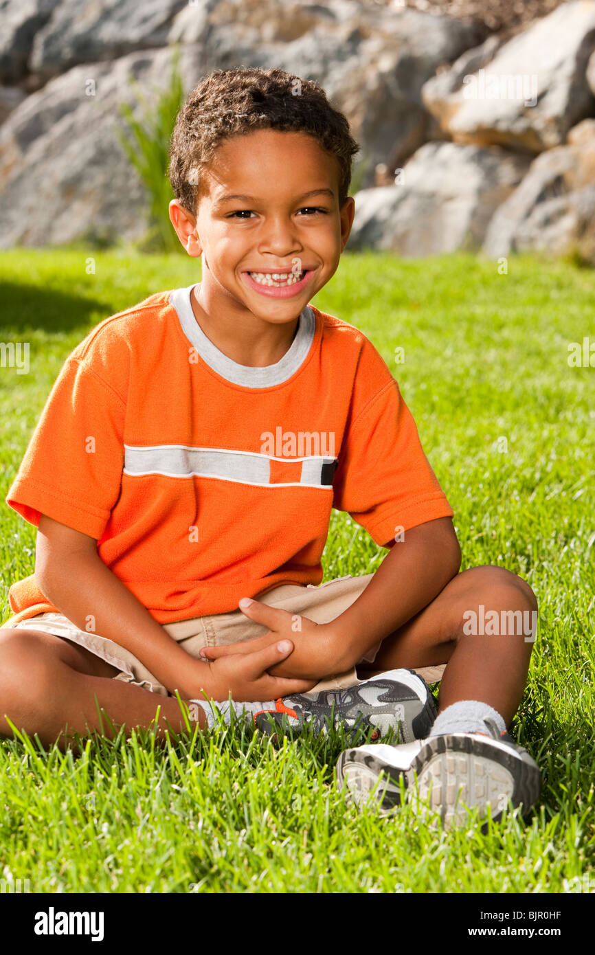 Boy smiling outside Stock Photo - Alamy