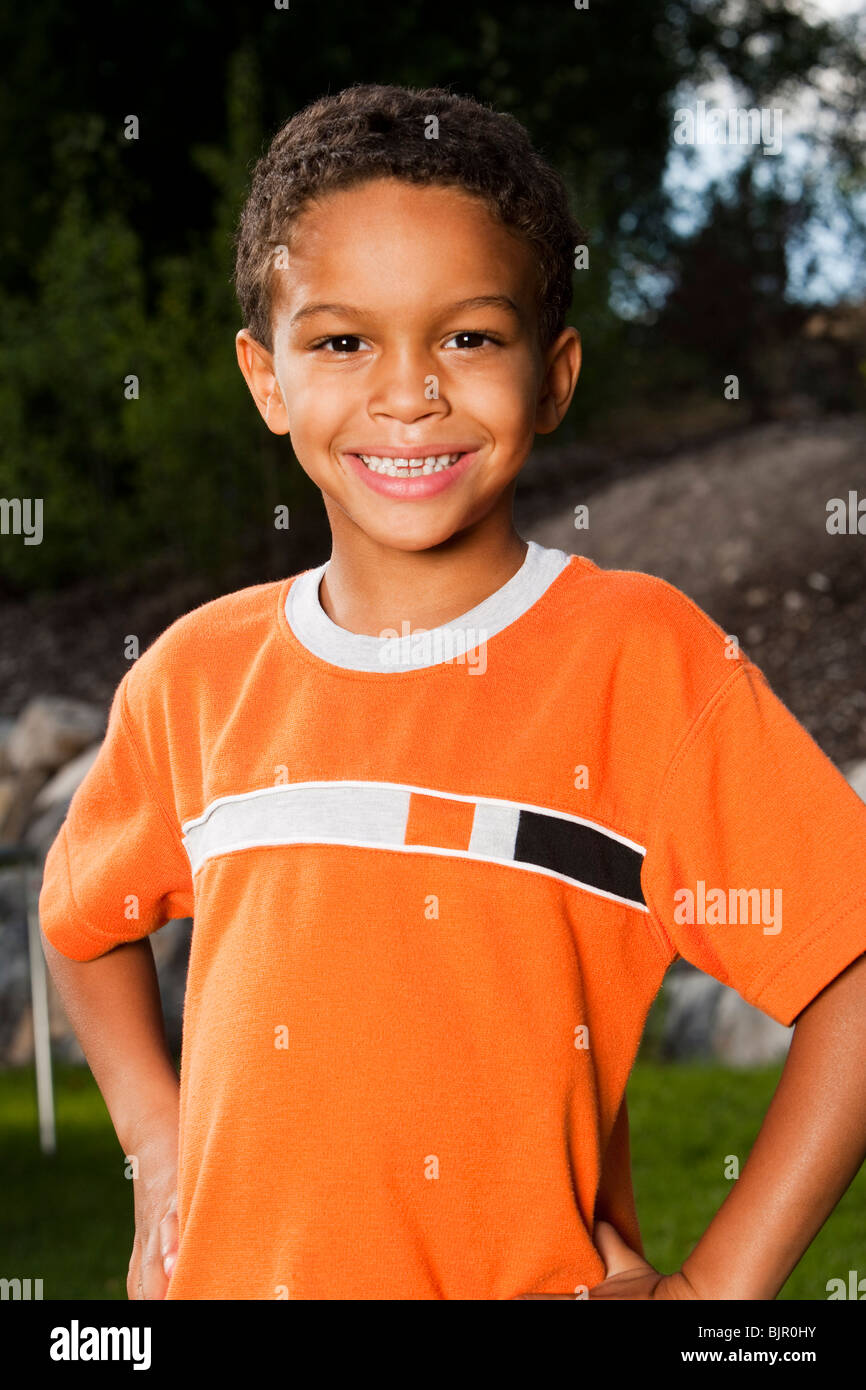 Boy smiling outside Stock Photo - Alamy