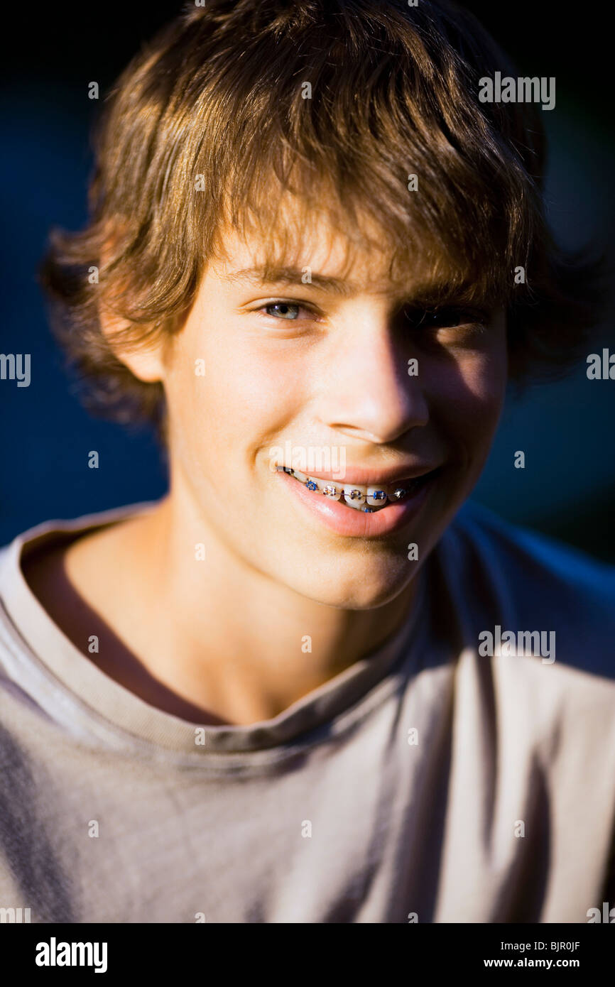 Boy with braces Stock Photo - Alamy