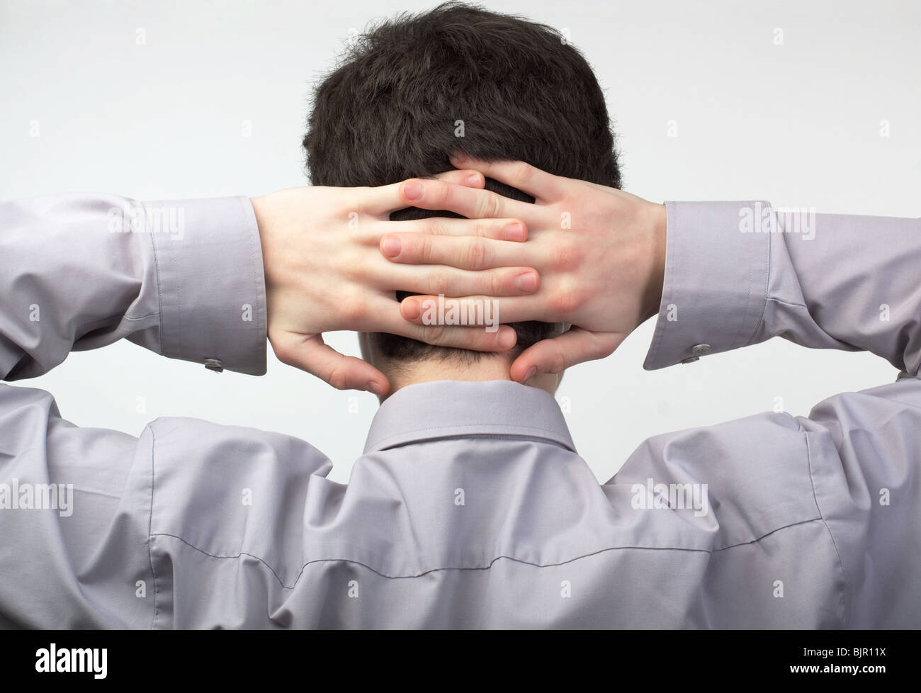 Arms crossed behind back hi-res stock photography and images - Alamy