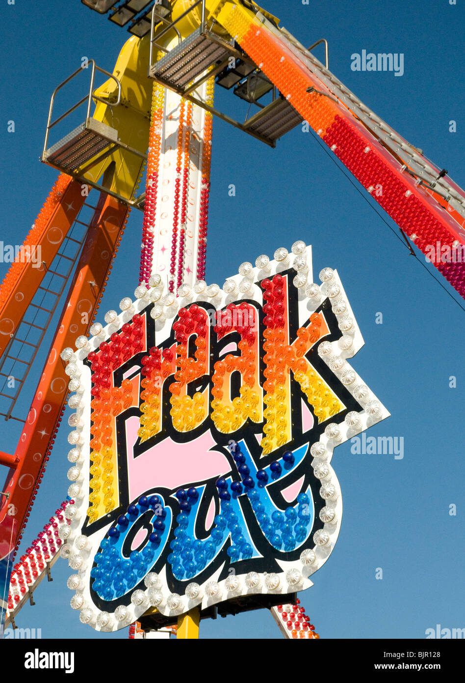 Freak Out fairground ride sign against A frames and blue sky, Tavistock ...