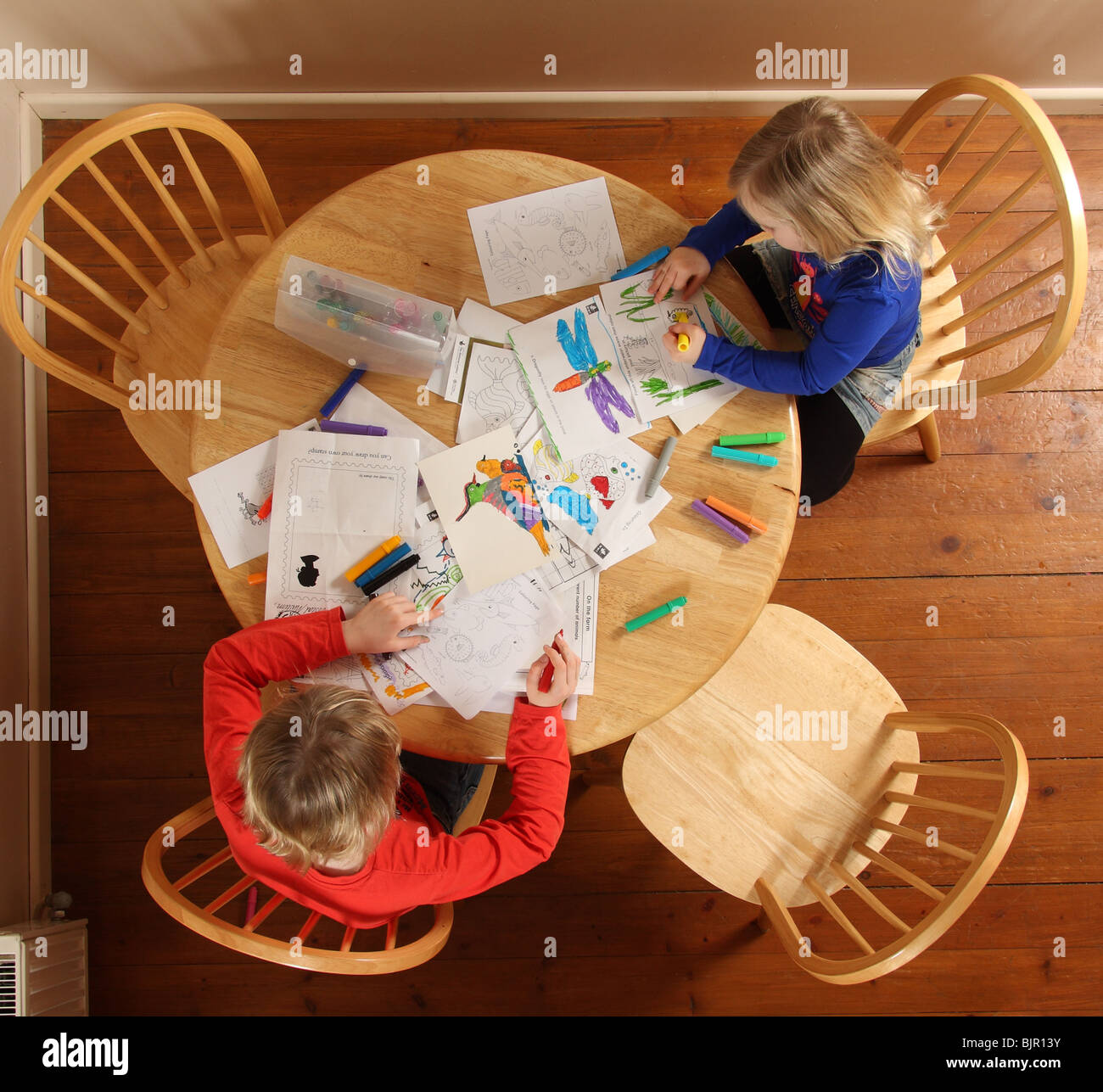 Boy and girl play learning indoors home learning Stock Photo - Alamy