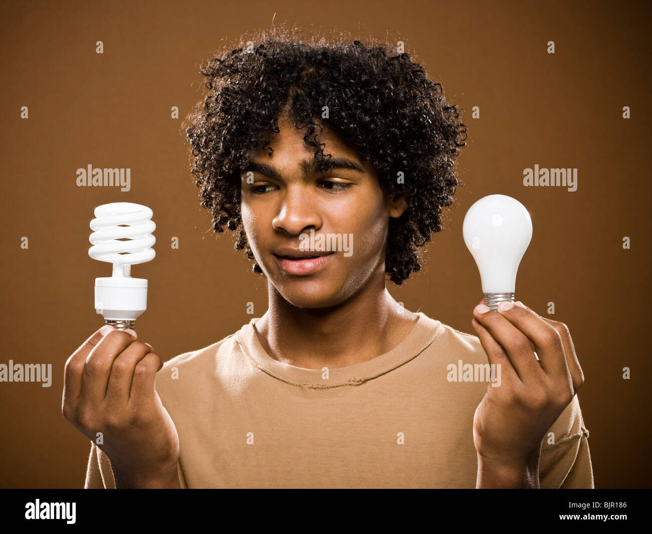 Boy holding light bulbs hi-res stock photography and images - Alamy