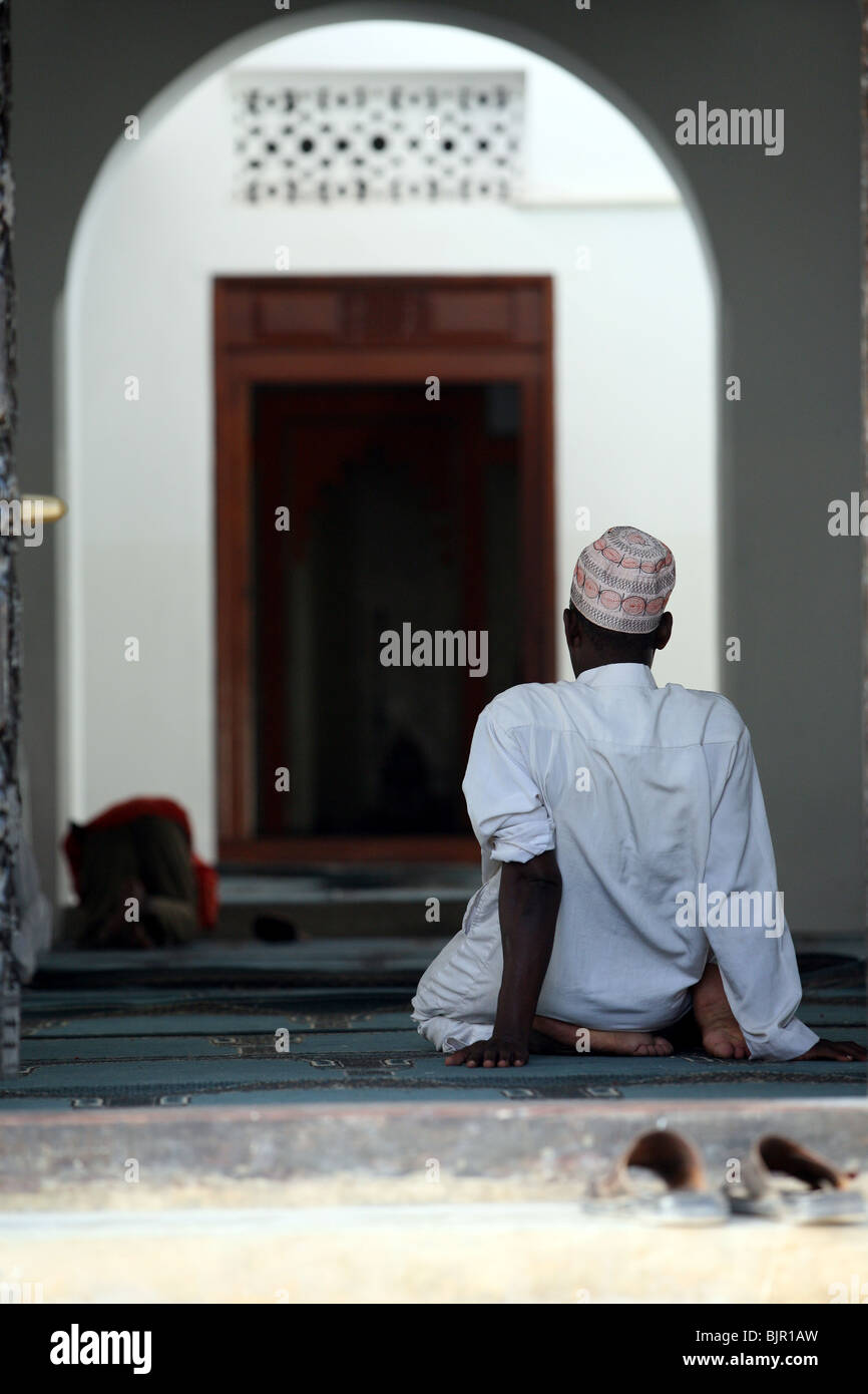A man during Maulidi in a doorway outside Riyadha Mosque Lamu Kenya ...