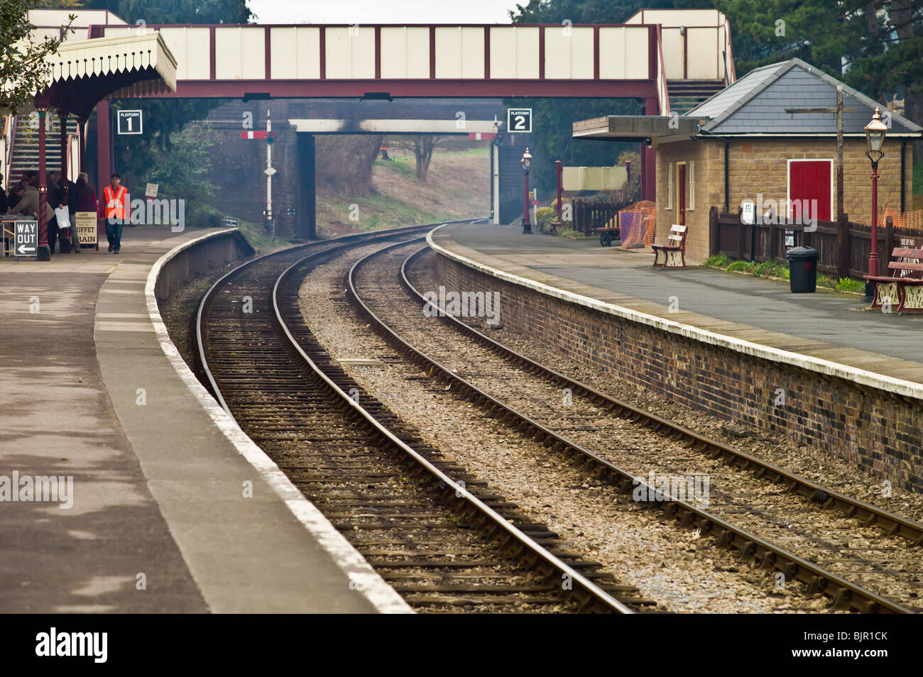 A station on a railway line in the countryside Stock Photo - Alamy