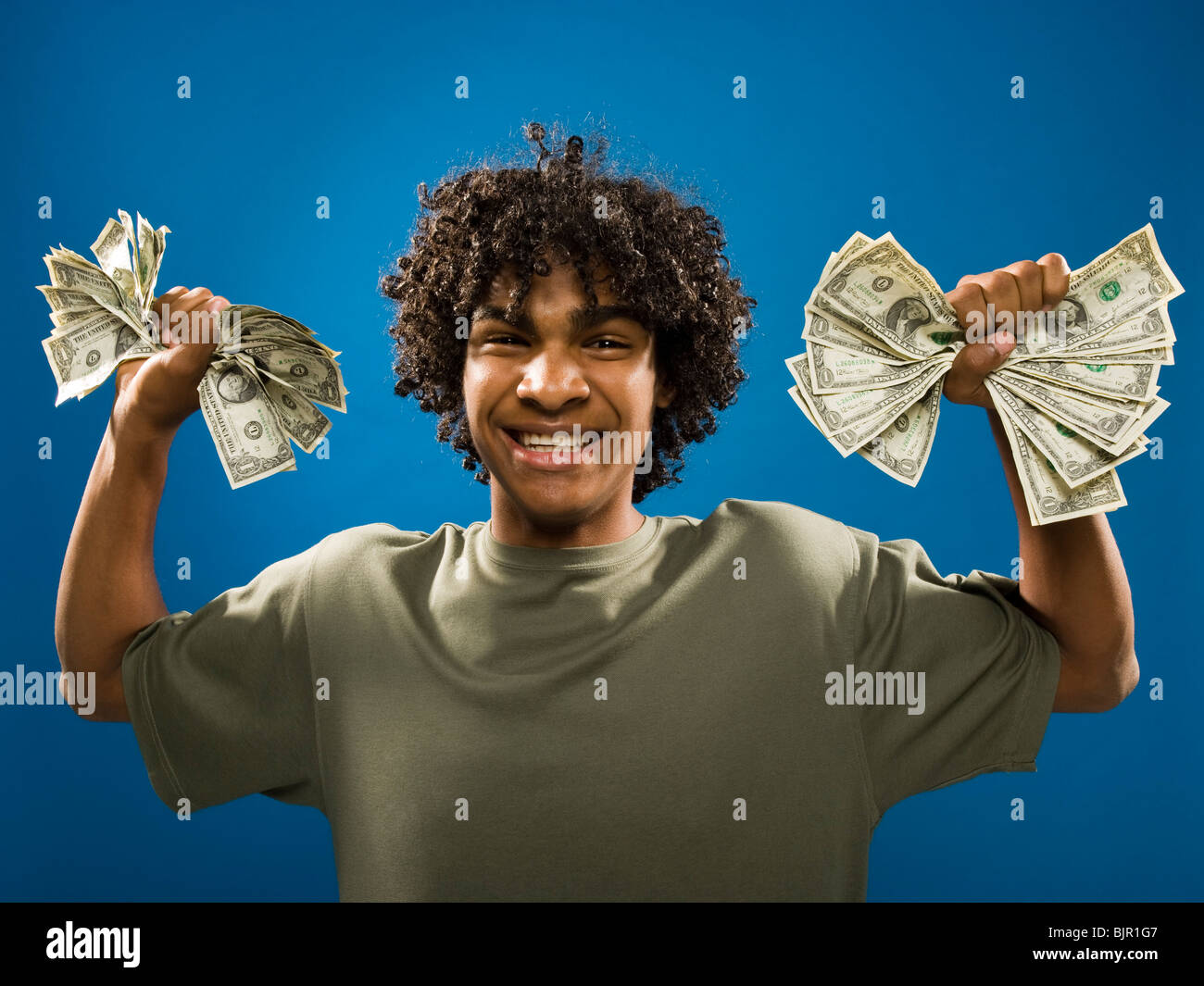 young man holding money Stock Photo - Alamy