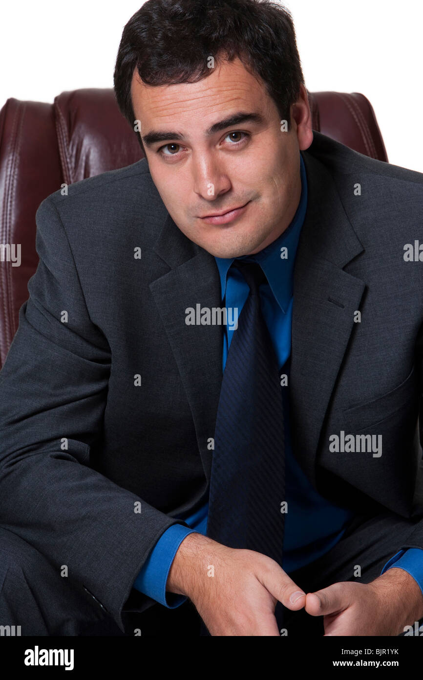 Businessman sitting in an office chair Stock Photo - Alamy