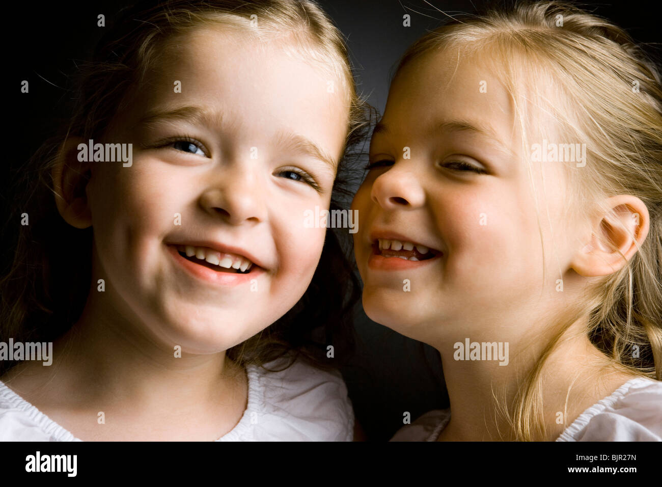 Two girls smiling Stock Photo - Alamy