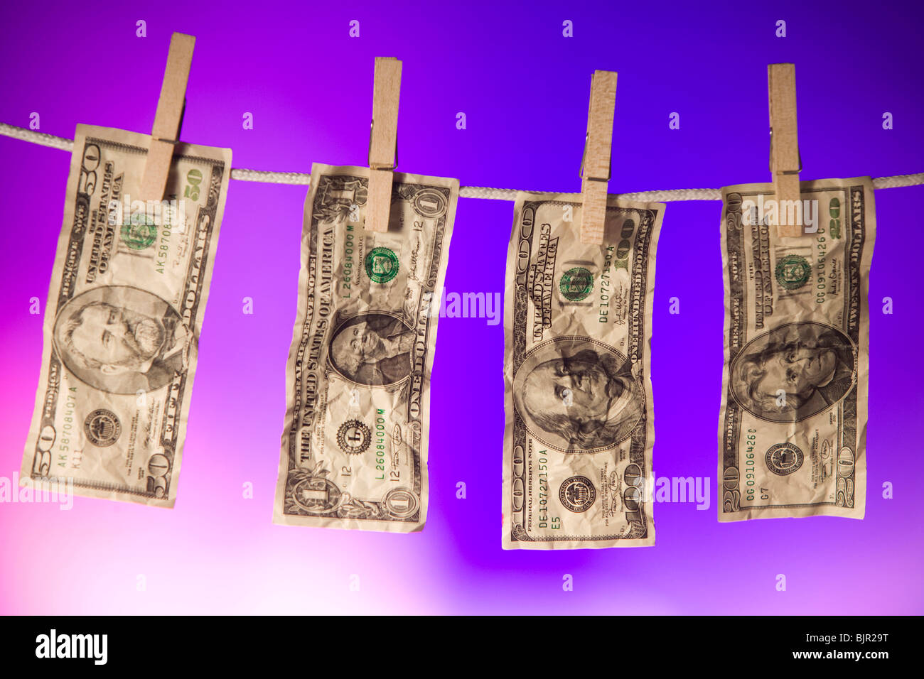 Banknotes on clothesline Stock Photo - Alamy