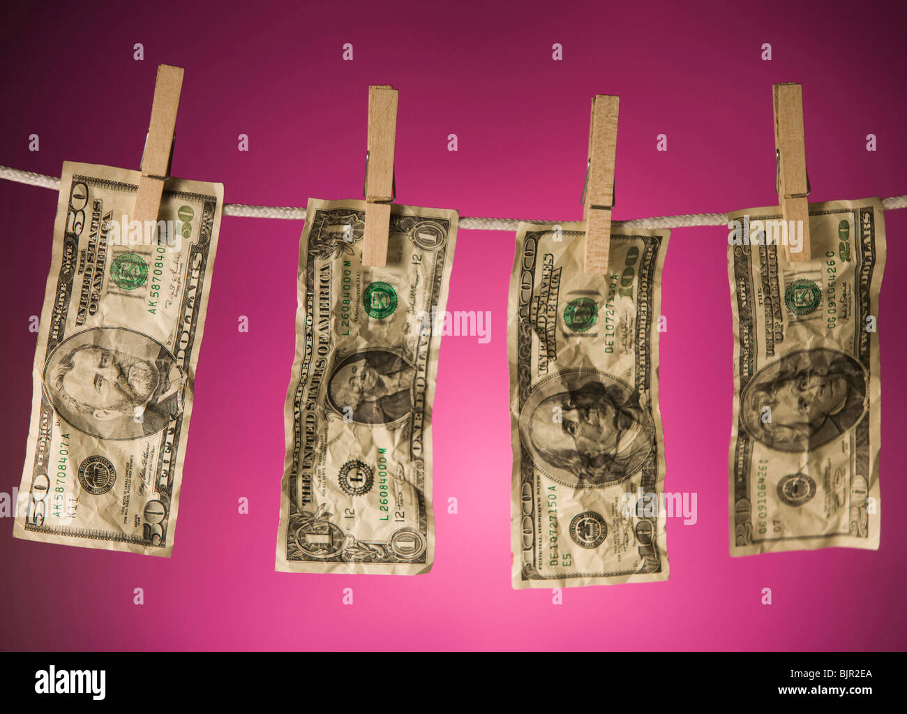 Banknotes on clothesline Stock Photo - Alamy