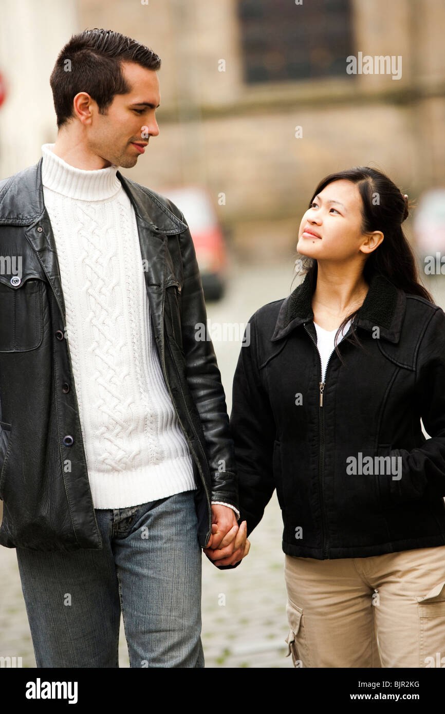 Young woman strolling down street hi-res stock photography and images ...