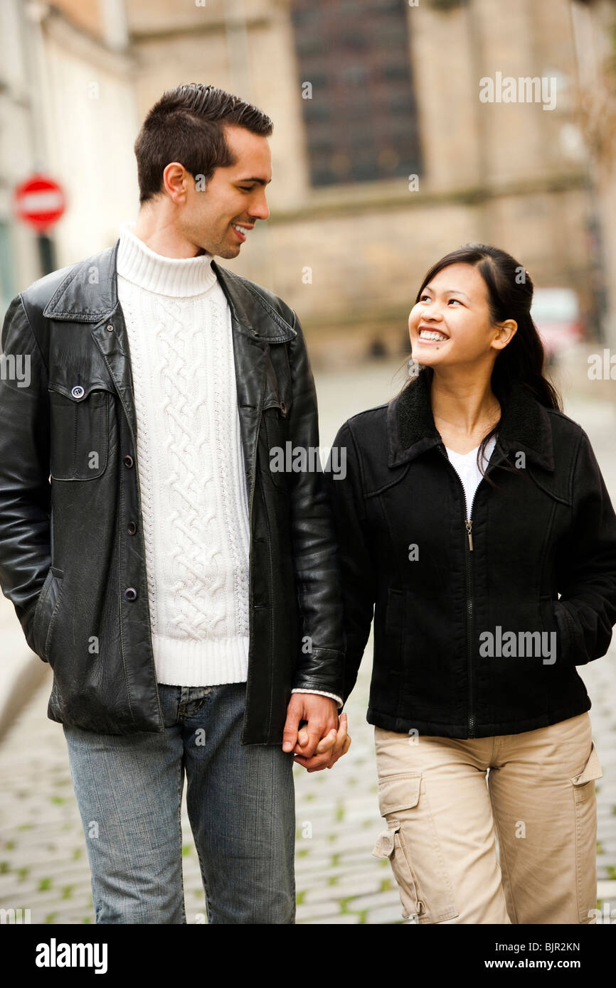 Young woman strolling down street hi-res stock photography and images ...