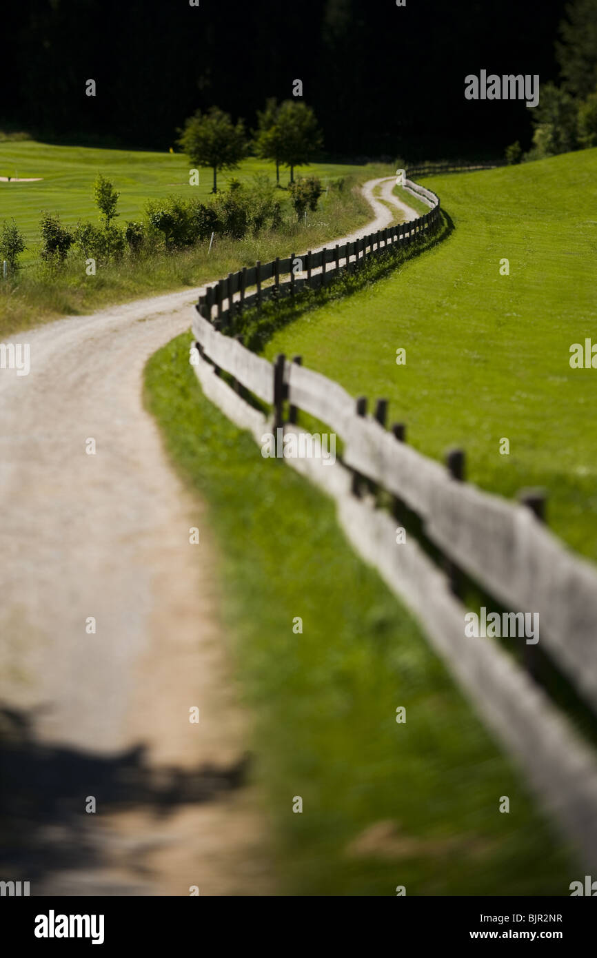 Winding path with wooden fence Stock Photo - Alamy