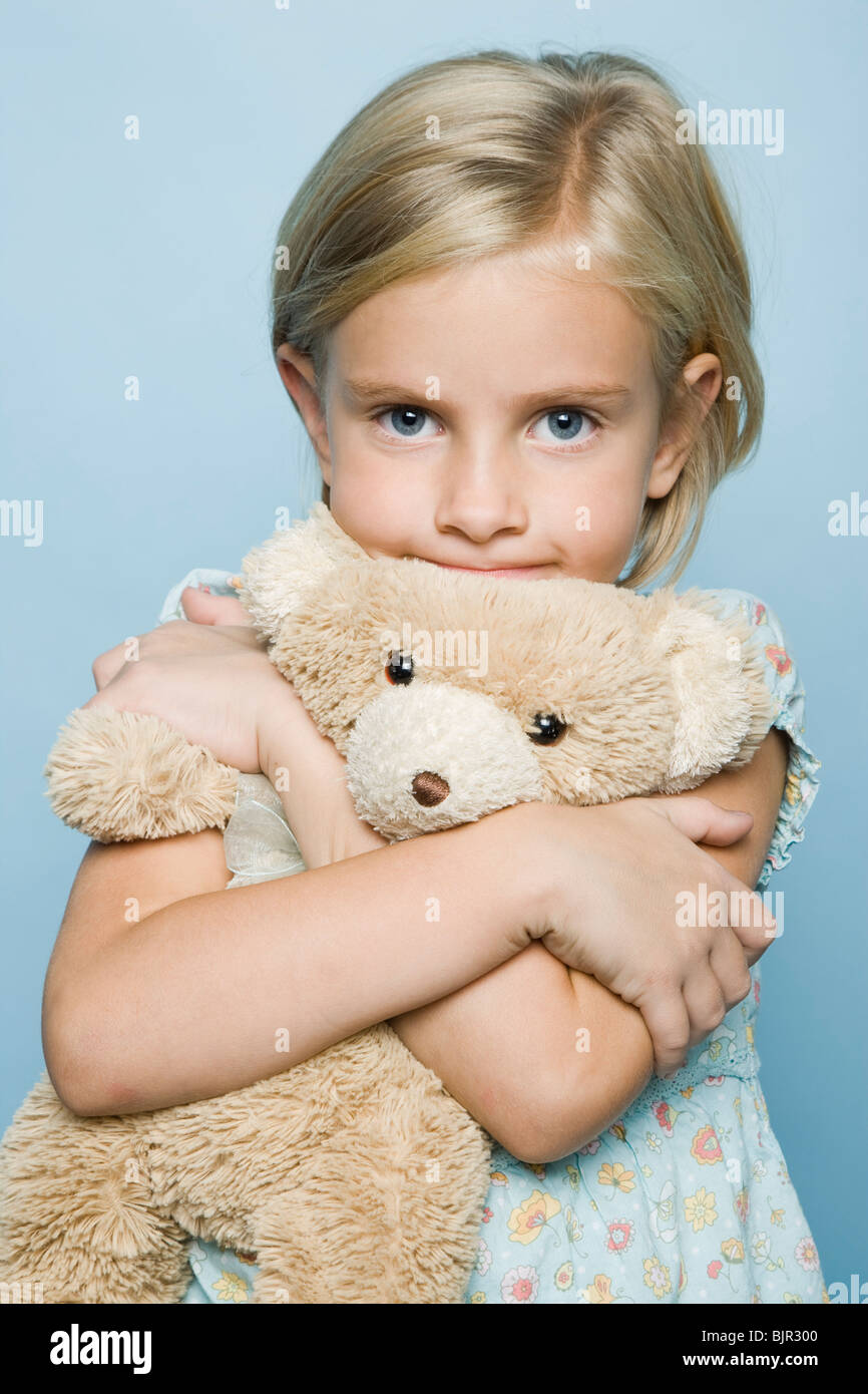 girl hugging teddy bear Stock Photo - Alamy