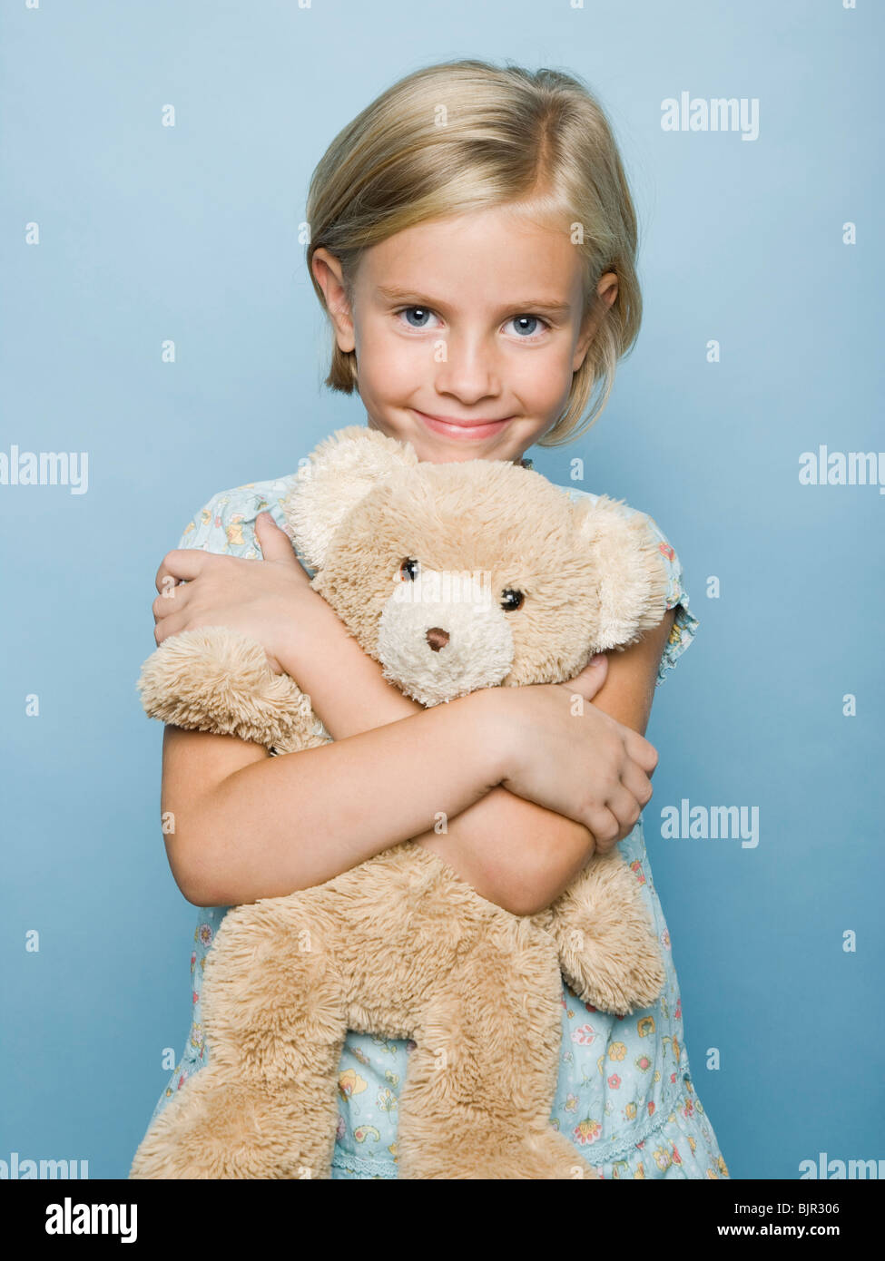 girl hugging teddy bear Stock Photo - Alamy