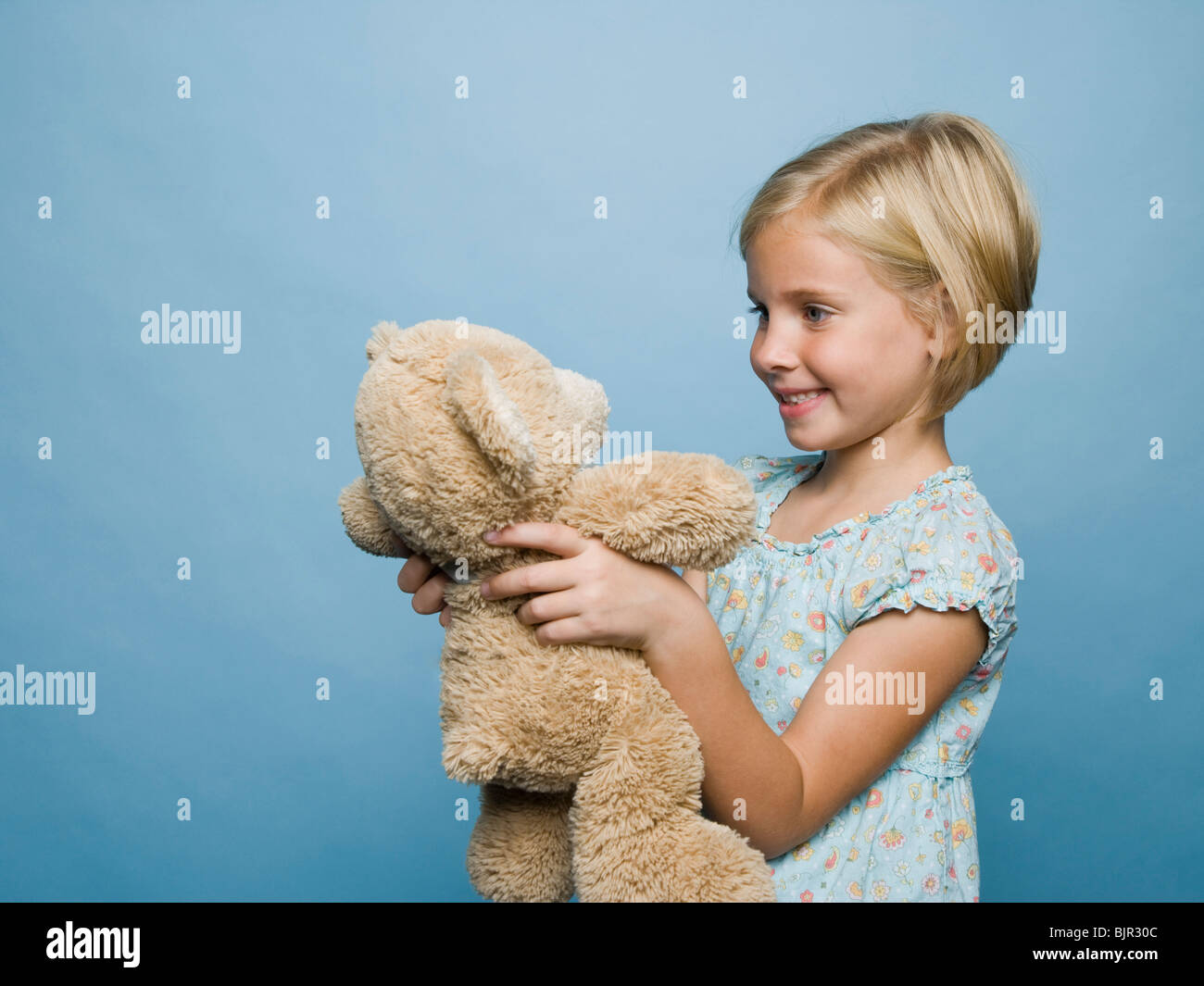 girl hugging teddy bear Stock Photo - Alamy