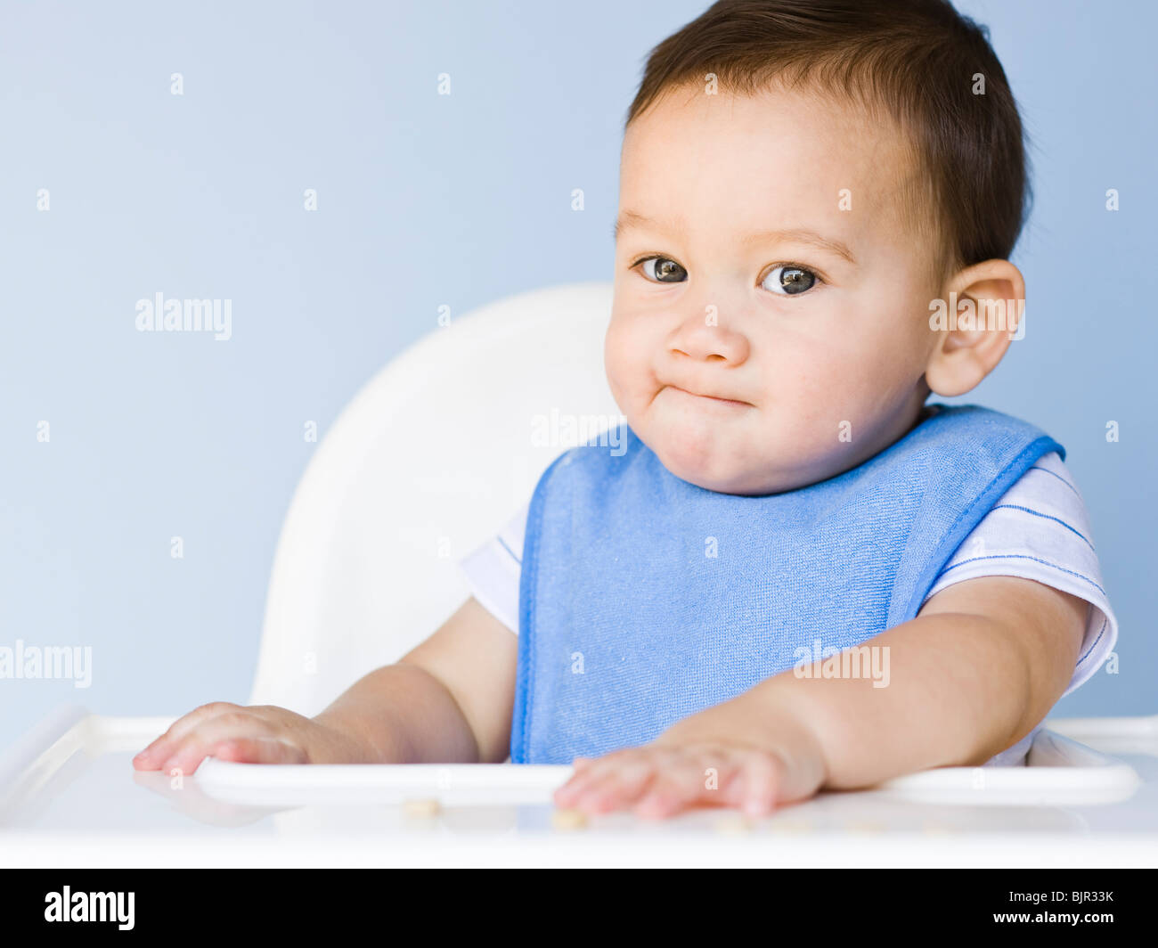 baby boy with a blue bib Stock Photo - Alamy