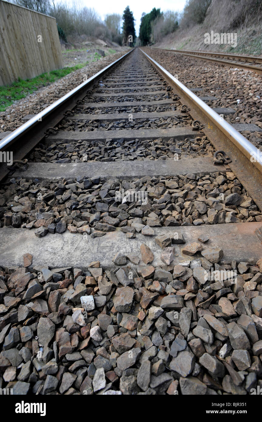 Empty train track heading off into the distance Stock Photo - Alamy