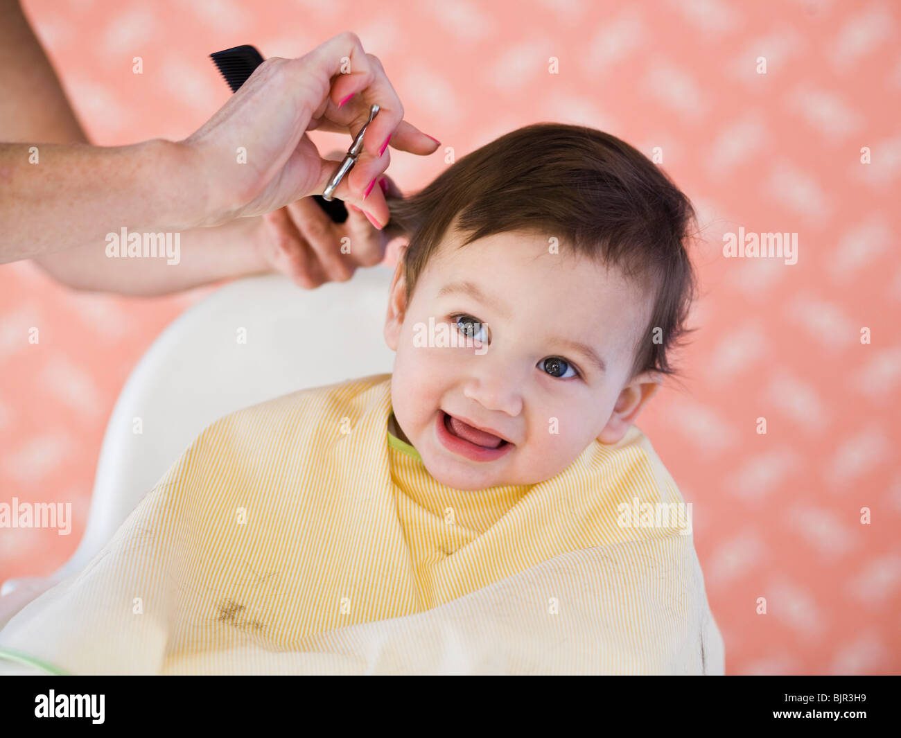 Baby getting a haircut Stock Photo - Alamy