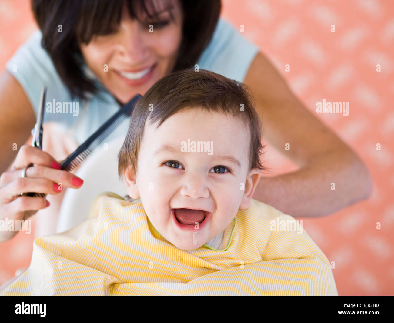 Baby getting a haircut Stock Photo - Alamy