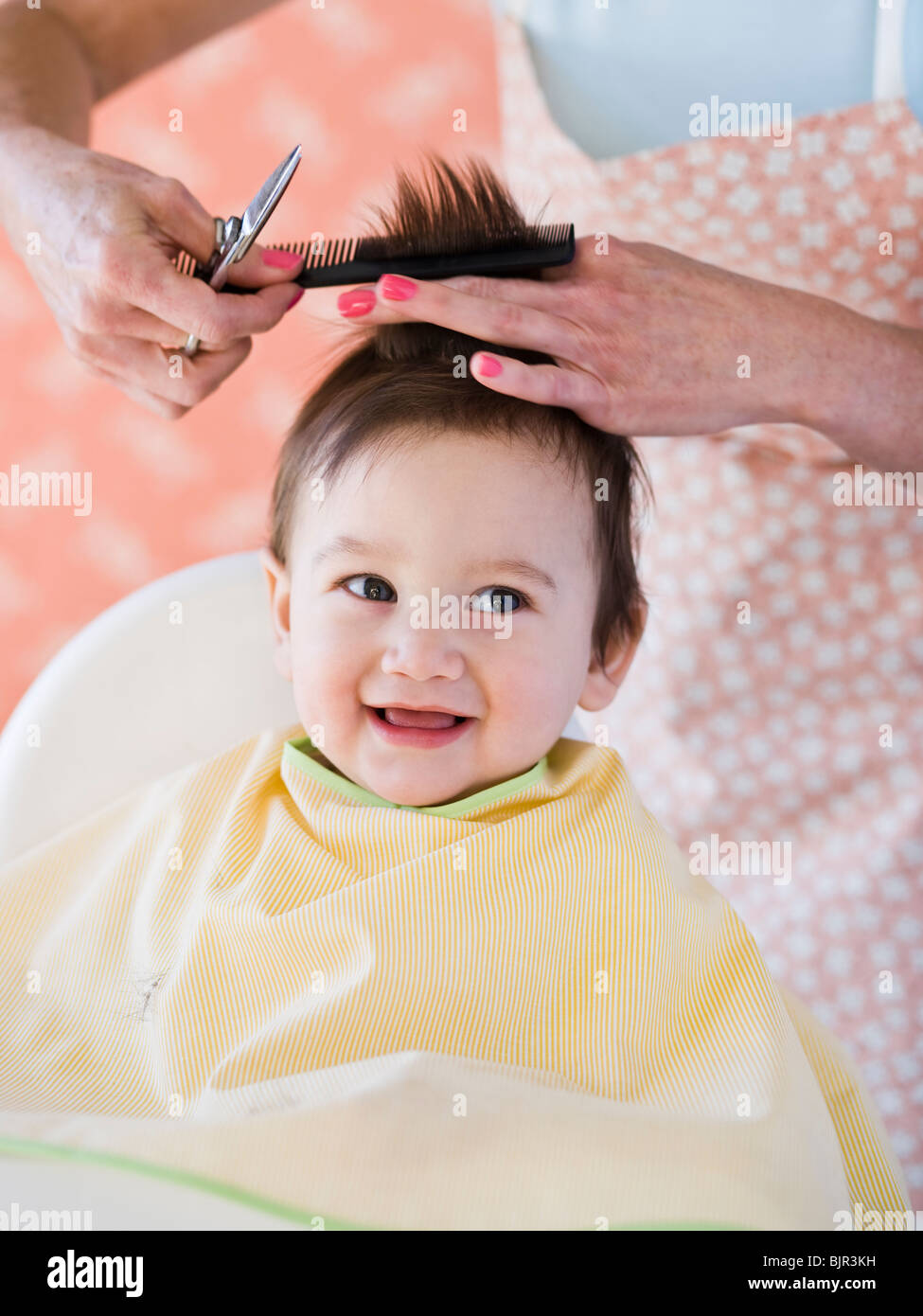 Baby getting a haircut Stock Photo - Alamy