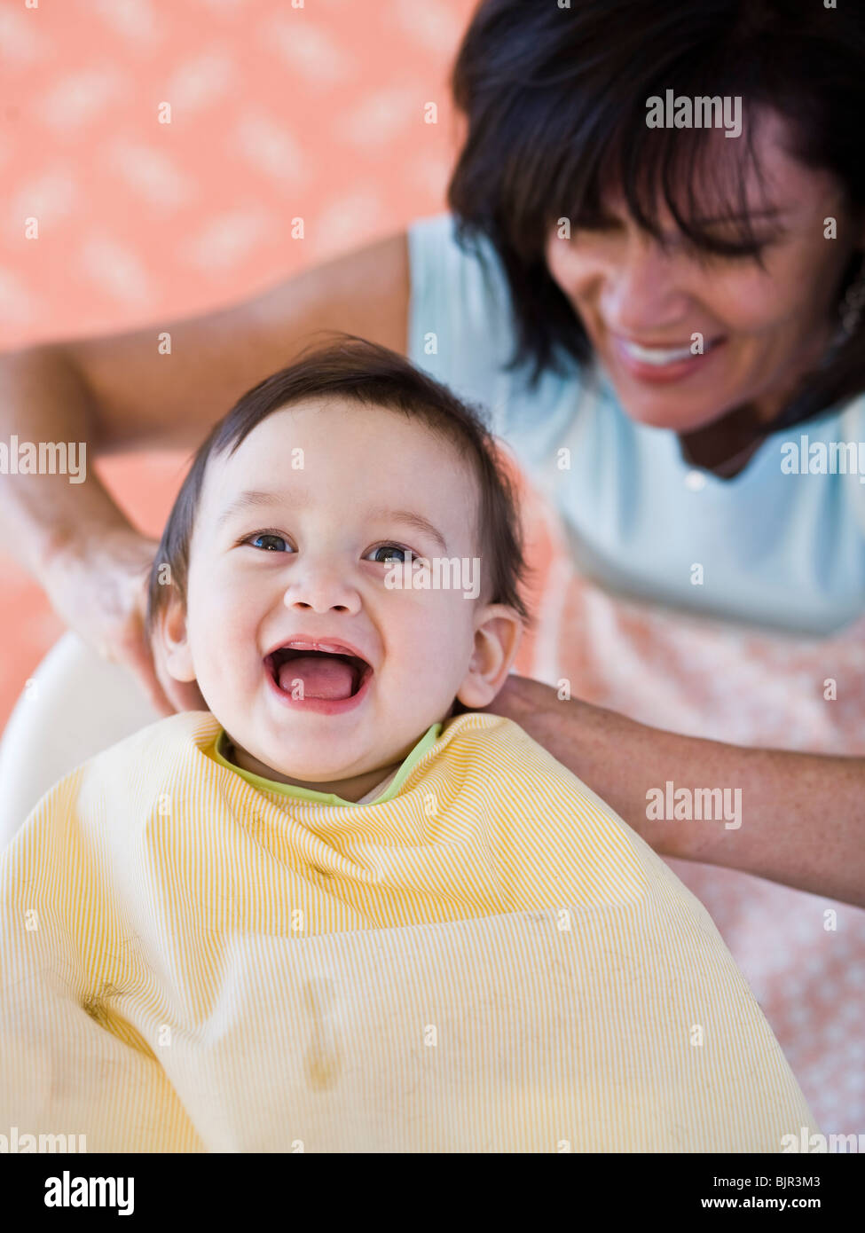 Baby getting a haircut Stock Photo - Alamy