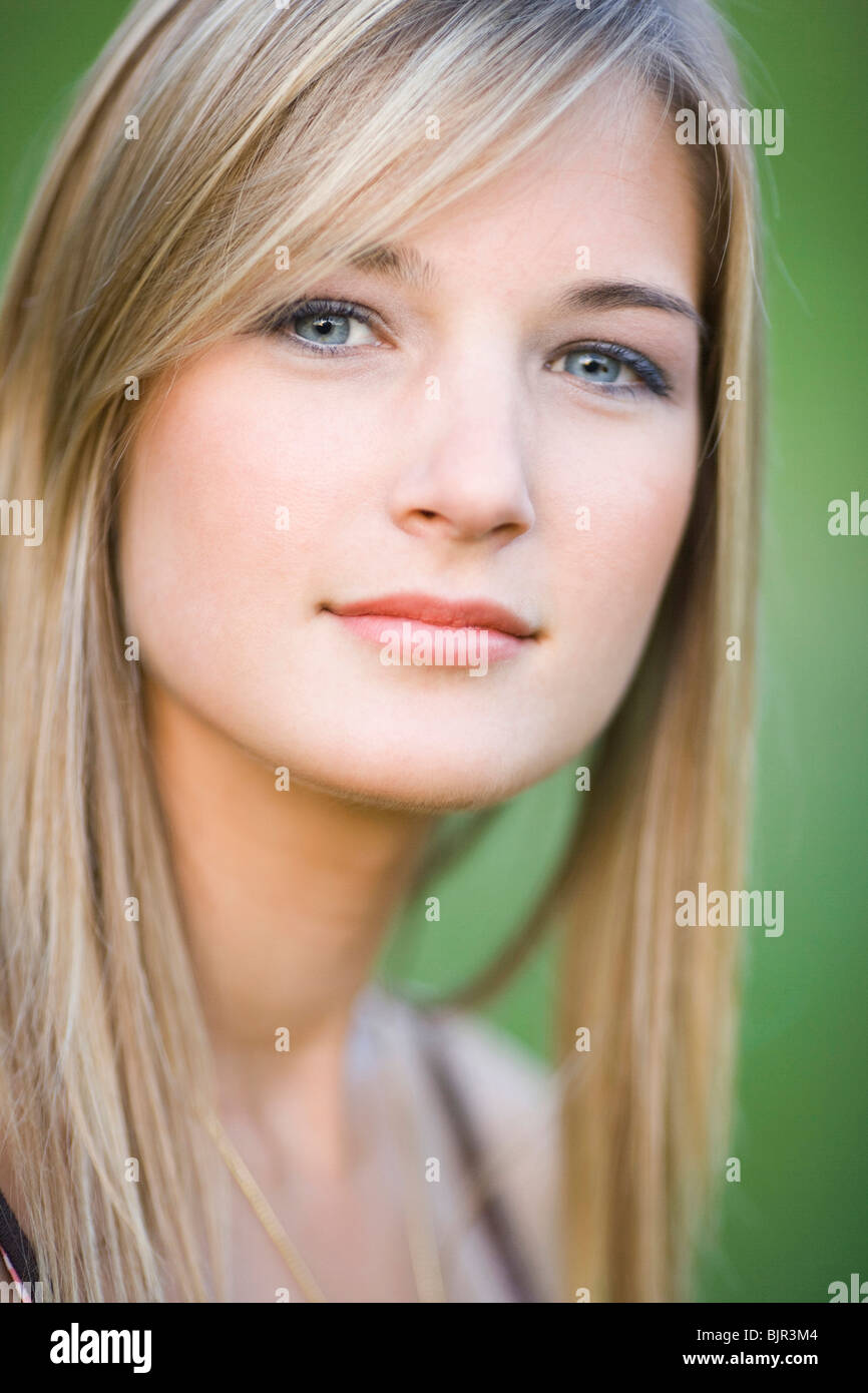 Teenage girl looking at the camera Stock Photo - Alamy