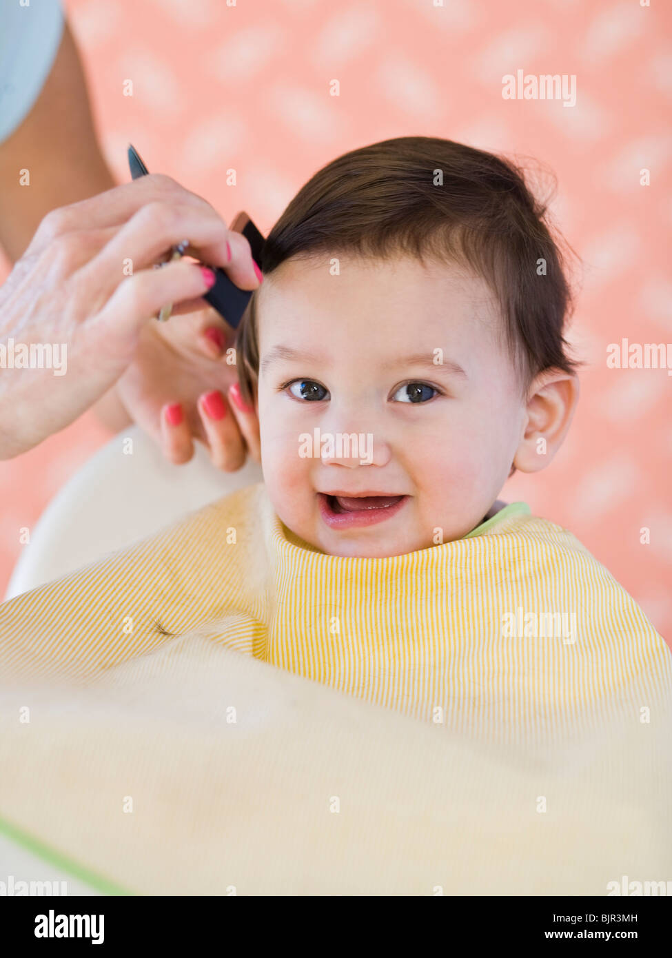 Baby getting a haircut Stock Photo - Alamy
