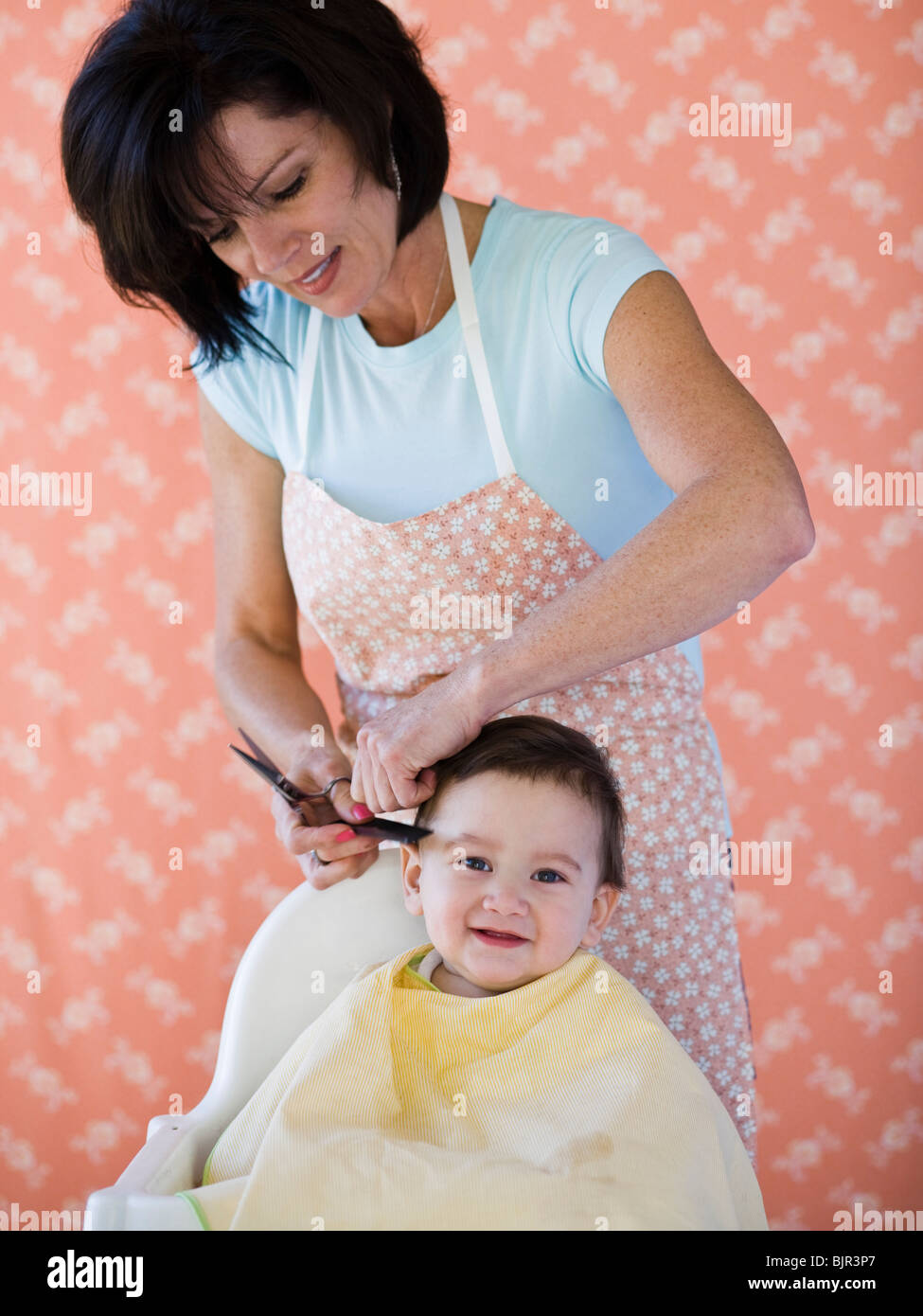 Baby getting a haircut Stock Photo - Alamy