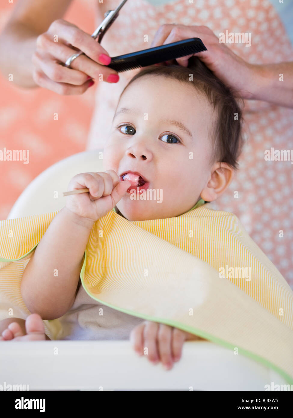 Baby getting haircut hi-res stock photography and images - Alamy