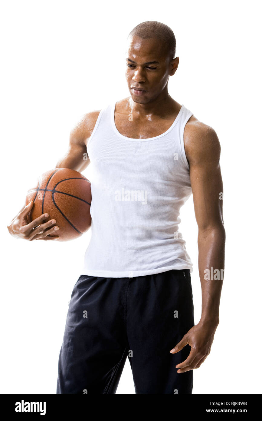 Man holding a basketball Stock Photo - Alamy