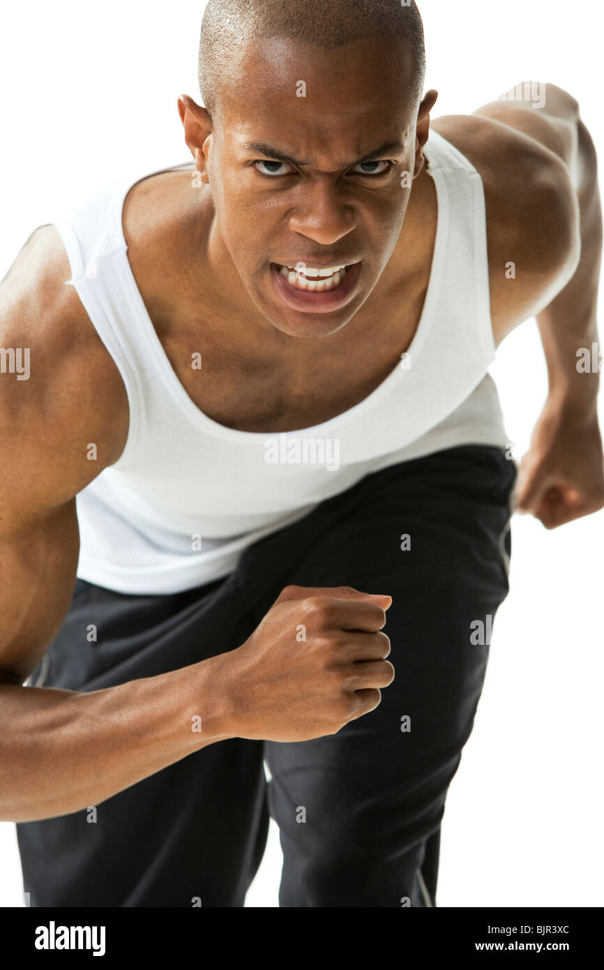 Excited young man running forward hi-res stock photography and images ...