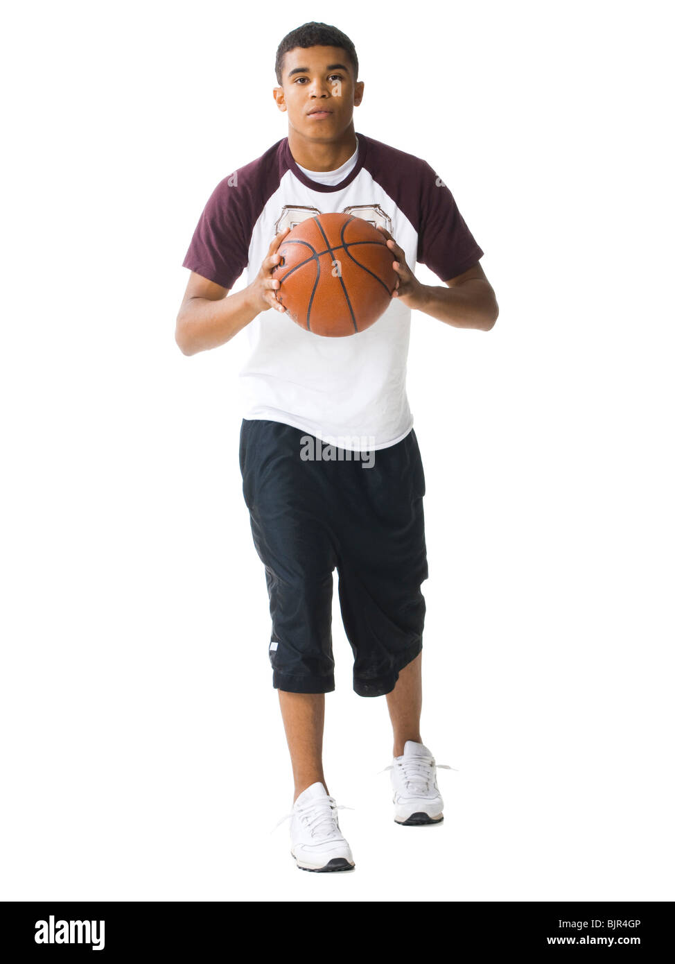 Teenage boy dribbling a basketball Stock Photo - Alamy
