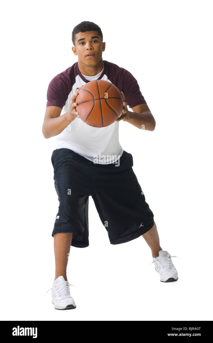 Teenage boy dribbling a basketball Stock Photo - Alamy