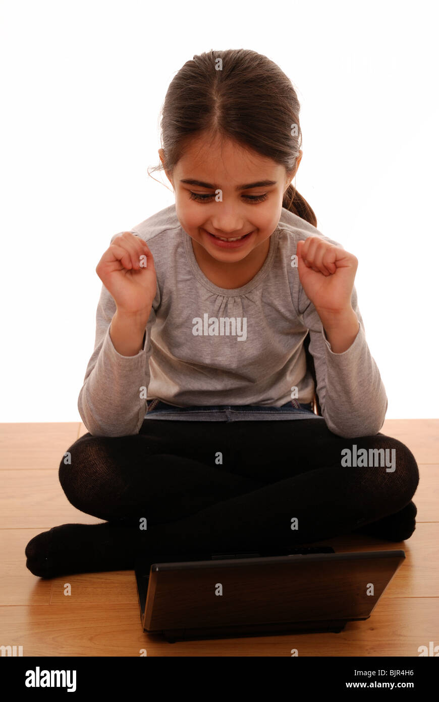 Young child having fun using a laptop computer Stock Photo - Alamy