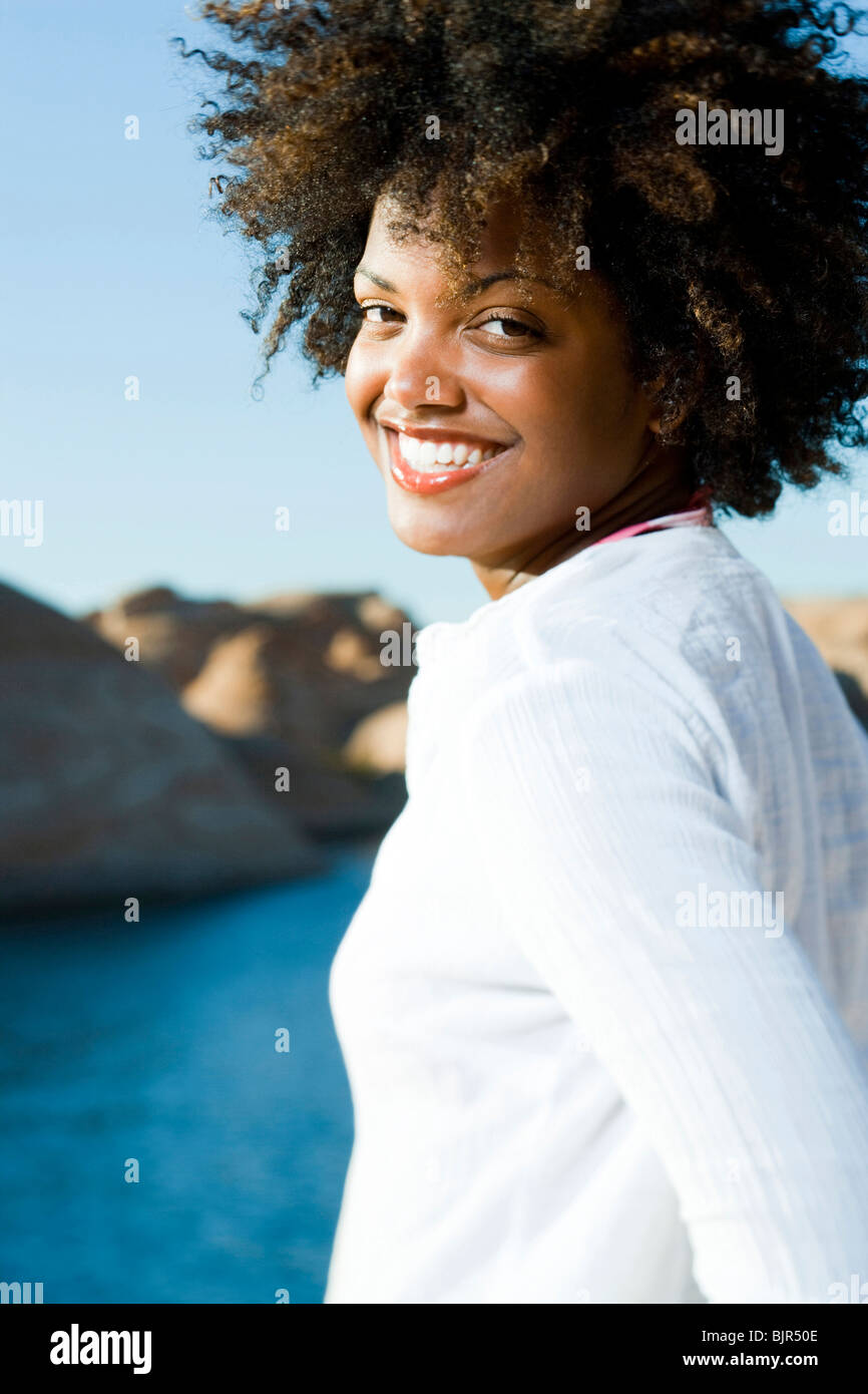 Woman outside smiling Stock Photo - Alamy