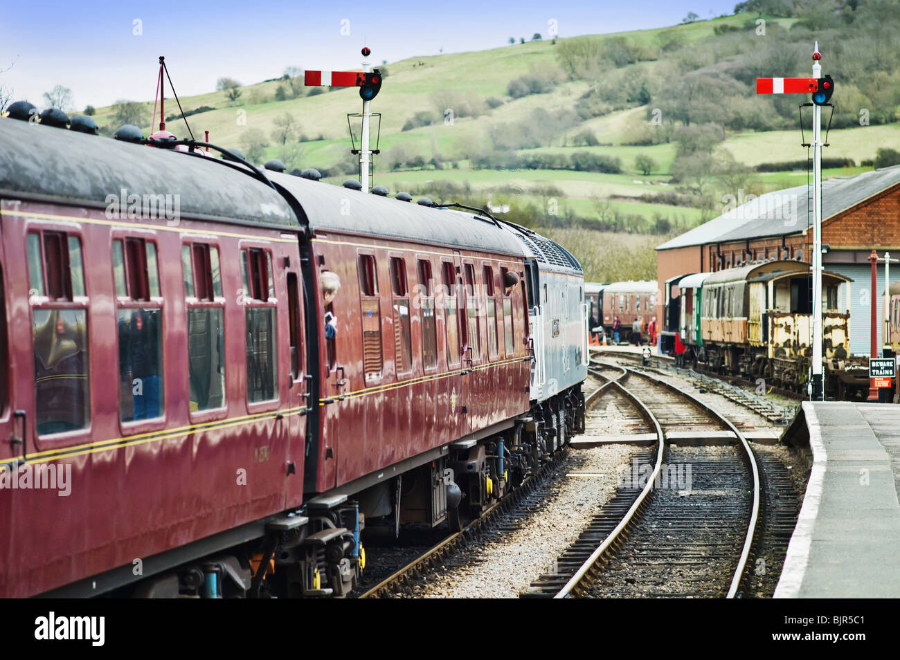 A station on a railway line in the countryside Stock Photo - Alamy